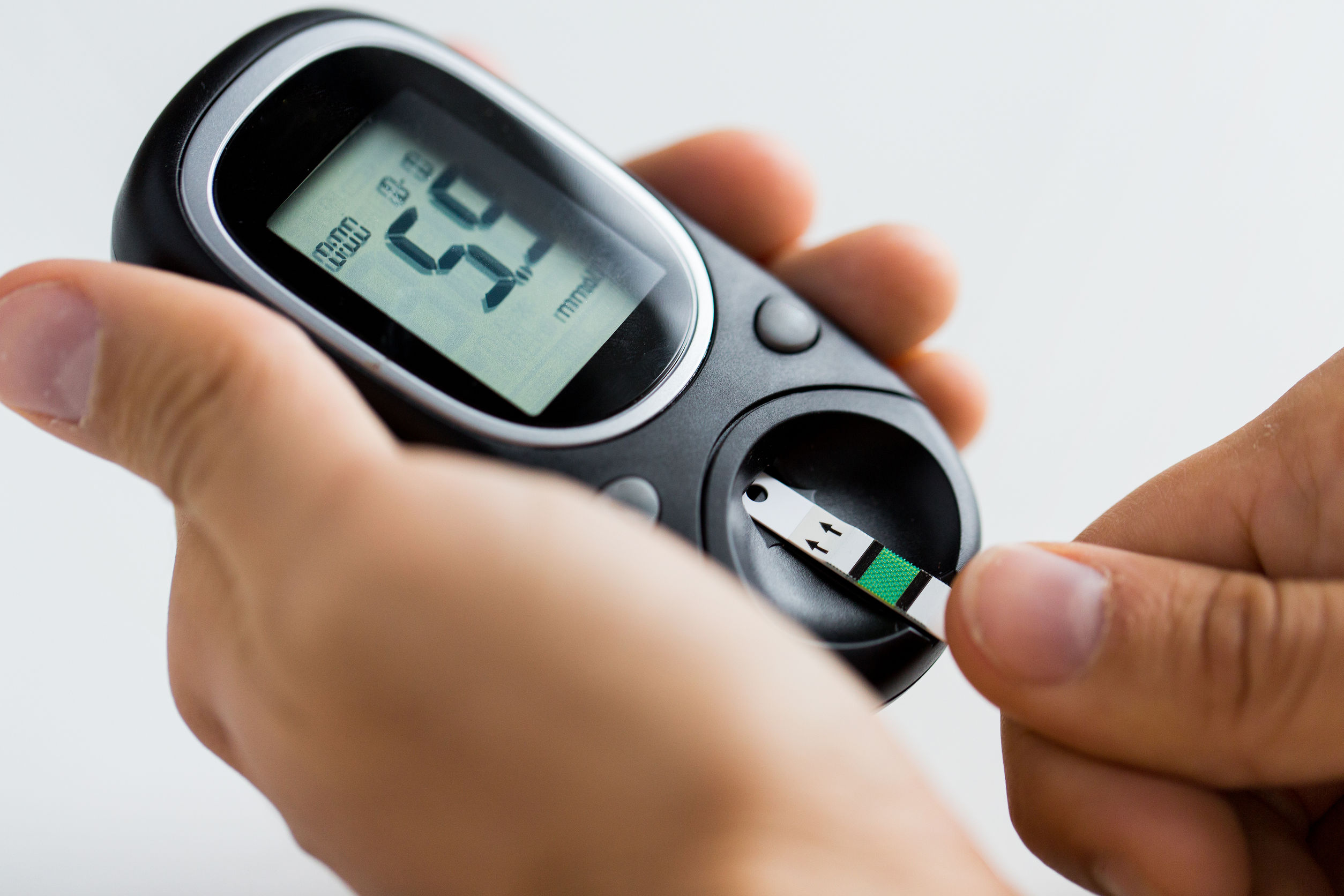 Close Up Of Man Checking Blood Sugar By Glucometer Family Medical